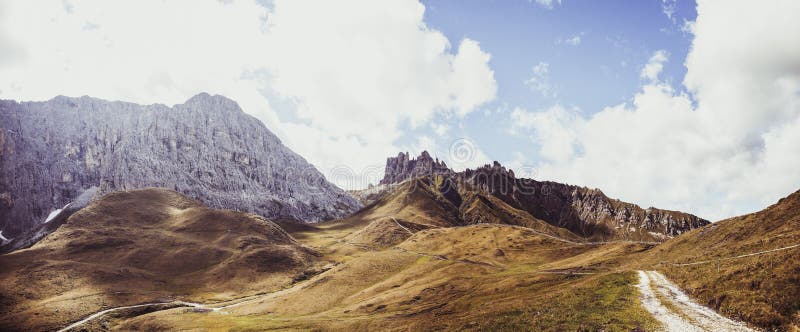 Horizontal Shot of a Wide Mountainous Land Under a Blue Sky with White ...