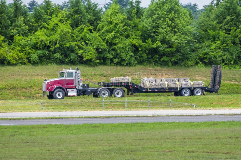Flatbed 18-Wheeler Carrying Load of Stone for Construction Stock Photo ...