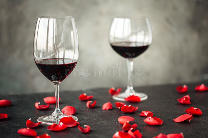 Side View on a Glasses of Red Wine with Petals Stock Photo - Image of ...