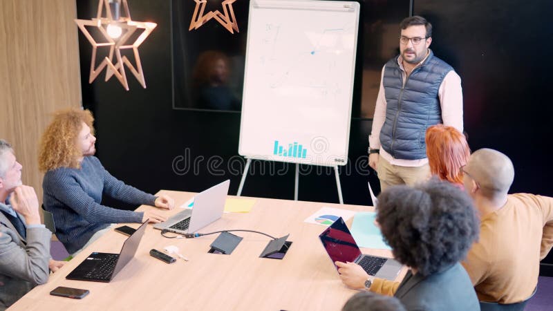 Worker Explaining a Project To Colleagues in a Meeting Room Stock Video ...