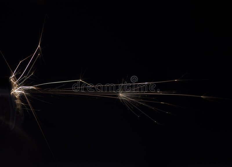 Horizontal Sparks Fly from Lighter with Black Background Stock Photo ...