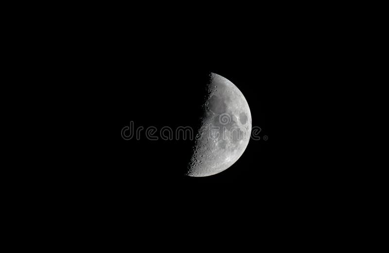 Horizontal View of a Clear Bright Half Moon in a Black Night Sky Stock ...