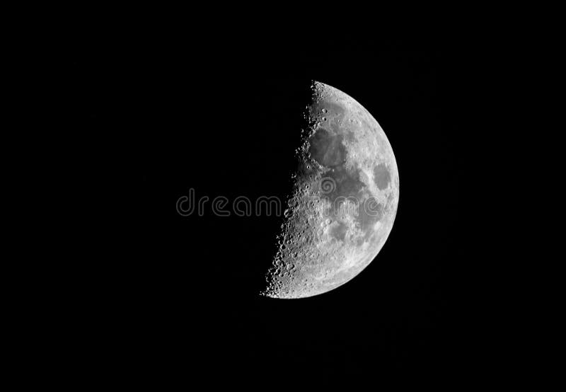 Horizontal View of a Clear Bright Half Moon in a Black Night Sky Stock ...