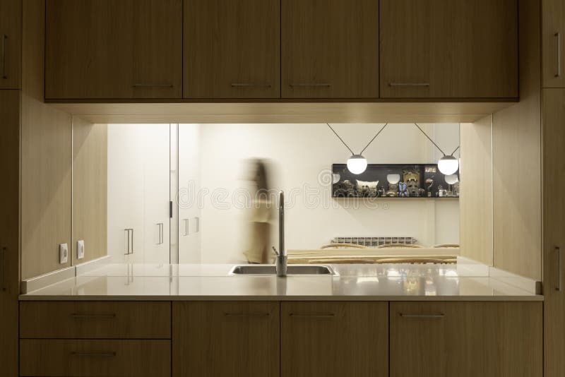 Horizontal View of Double Modern Wood Kitchen with Person in Movement ...