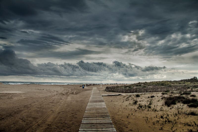 Horizontal View of a Pathway Leading To a Beach through the Sand Under ...