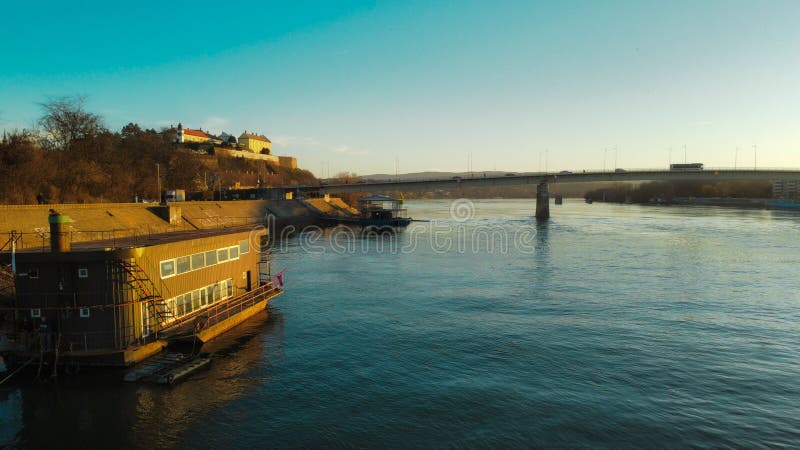 Horizontal View of a River with a Building on the Riverside with Nature ...