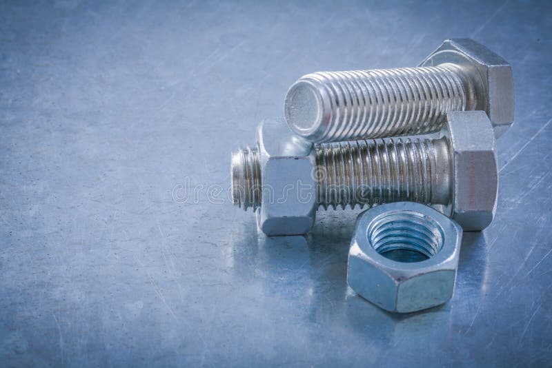 Horizontal View of Stainless Bolts Screw-nuts on Metallic Backgr Stock ...