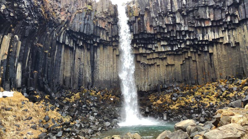 Waterfall Tumbling Down a Hexagonal Basalt Structure Horizontal Shot ...