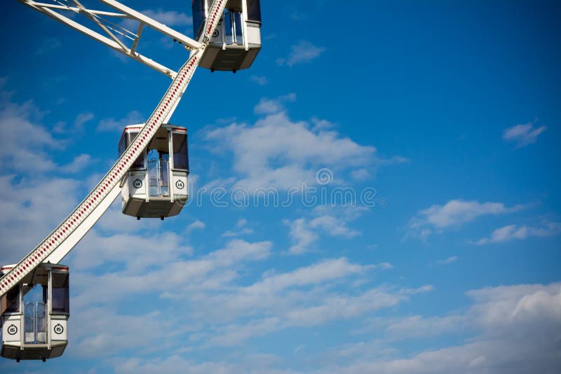 Horizontal View of a White Ferris Wheel on Partially Cloudy Sky Stock ...