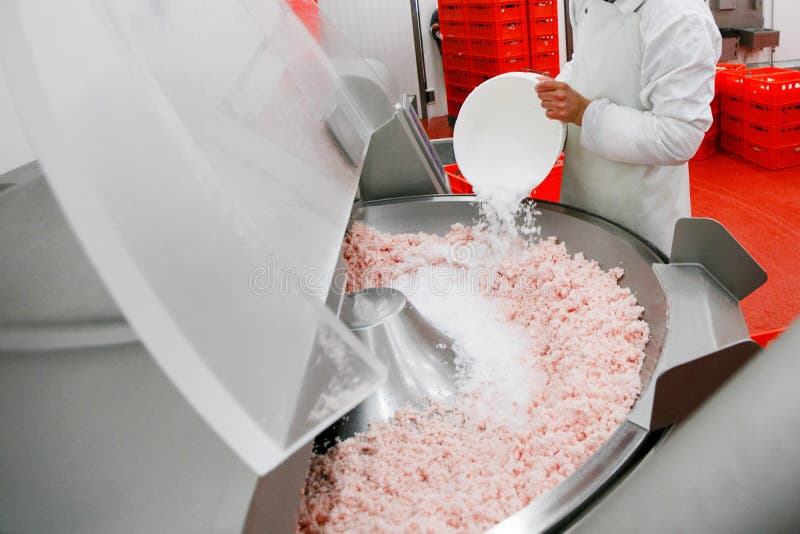 A Worker at the Meat Processing Factory, Adds Spices To Minced Meat in ...