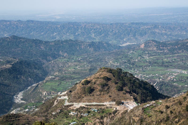Horizontal Wide Angle Shot of a Mountain Range with a Small Hill in the ...