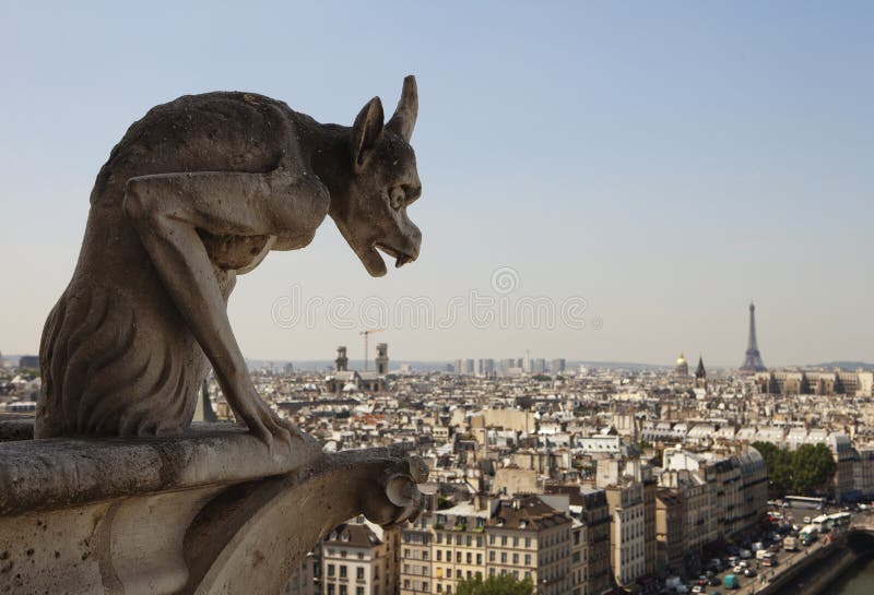 Horned Gargoyle with Eiffel Tower Stock Photo - Image of dame, carving ...