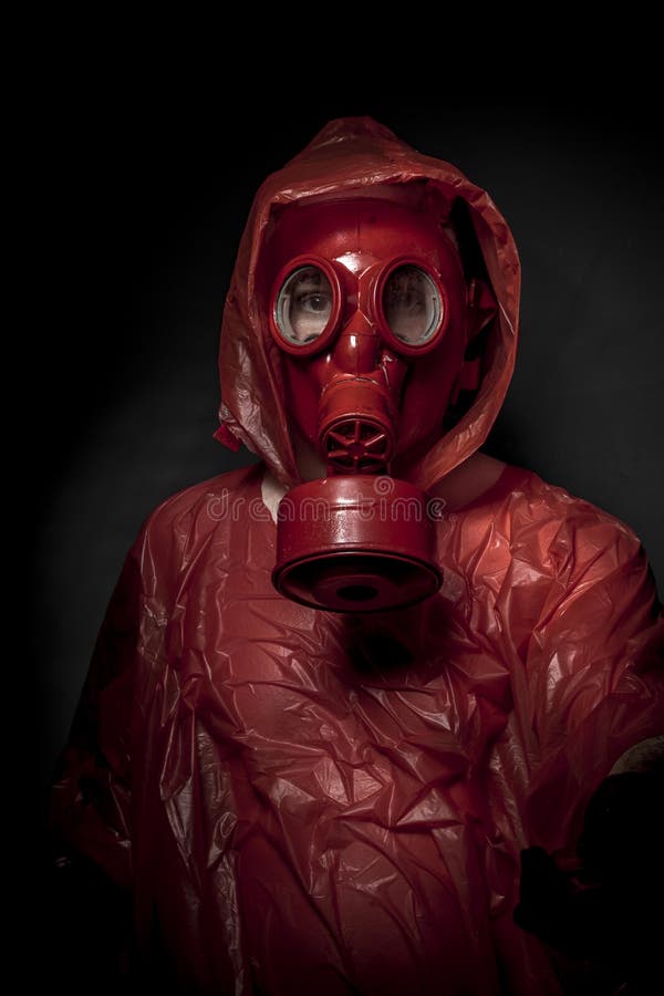 A Man In A Gas Mask Over The Smoke. Black Background And Red Co Stock ...