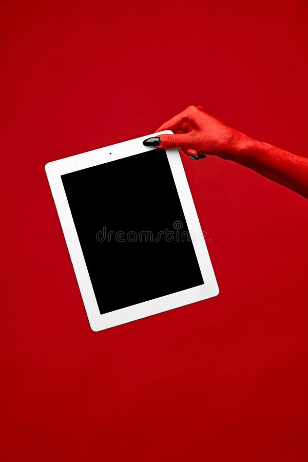 Horror Red Devil& X27;s Hand with Blank Long Nails Holding Tablet with ...