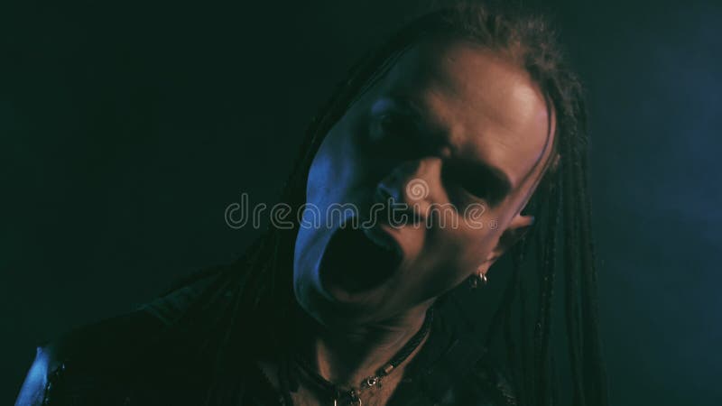 Demon in Human Form. the Man`s Face Turns into the Face of a Demon ...