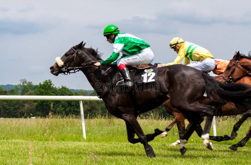 At the horse race editorial image. Image of jokey, speed - 167438420