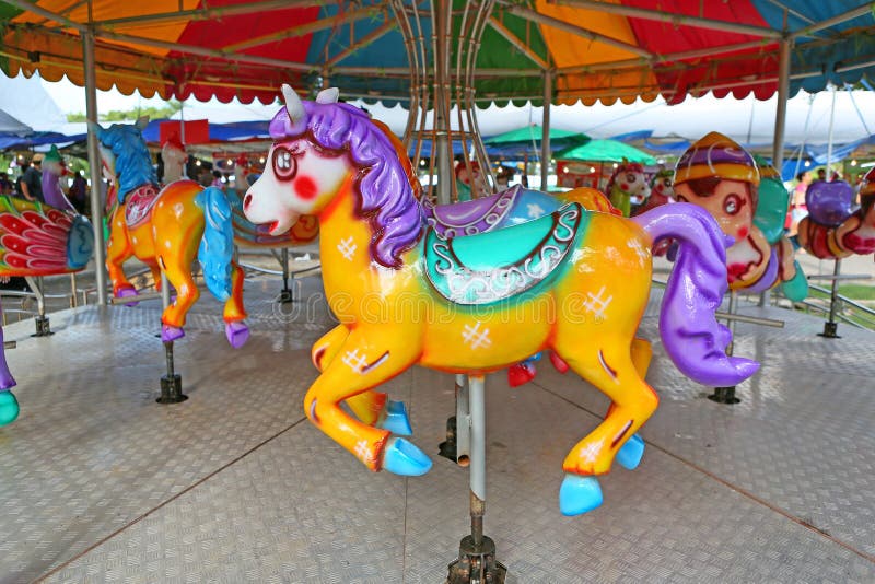 Horses on a Carnival Merry Go Round. Old French Carousel in a Holiday ...