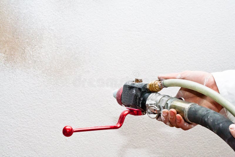 Hose machine spackling stock photo. Image of apartment - 52246412