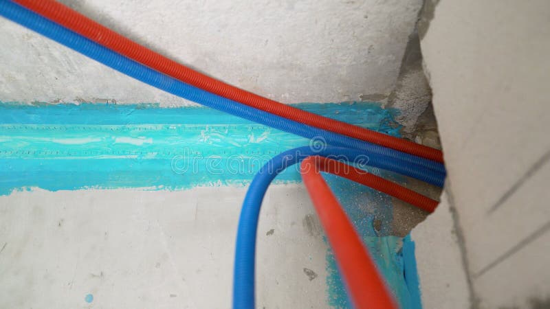 Water Supply Pipes. the Hoses in the Bathroom are Red and Blue, Hot and ...