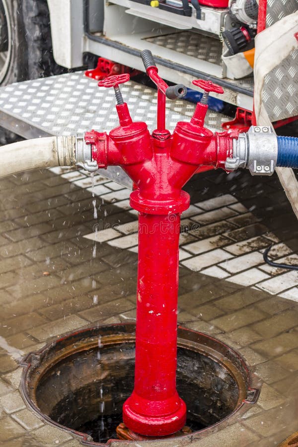 Hoses connected to hydrant stock image. Image of hydrant - 212416905