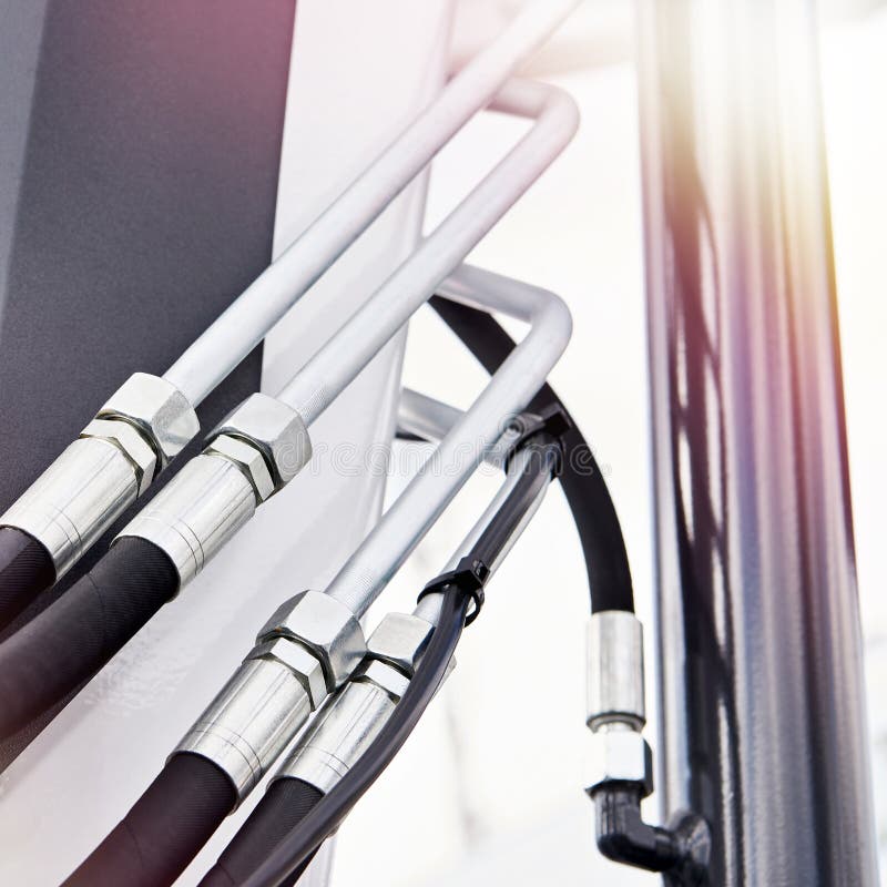Hoses of hydraulic machine stock photo. Image of pipe - 380367518