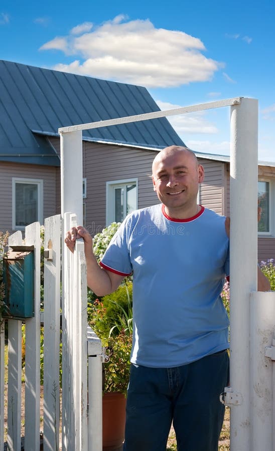 Hospitable Adult Man Near Gate Stock Image - Image of outdoors, cottage ...