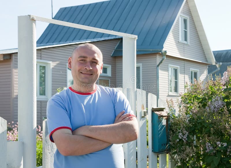 Hospitable man near gate stock photo. Image of smiling - 23379500