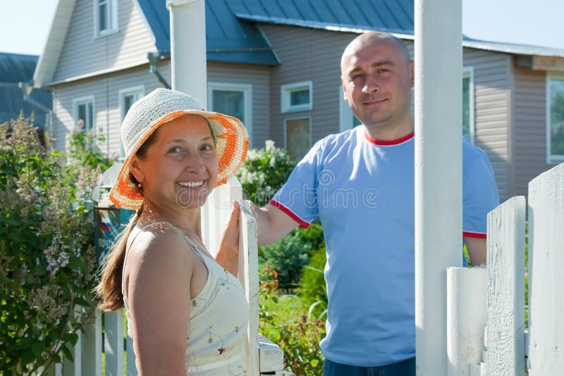 Hospitable man and woman stock image. Image of home, attractive - 22079171