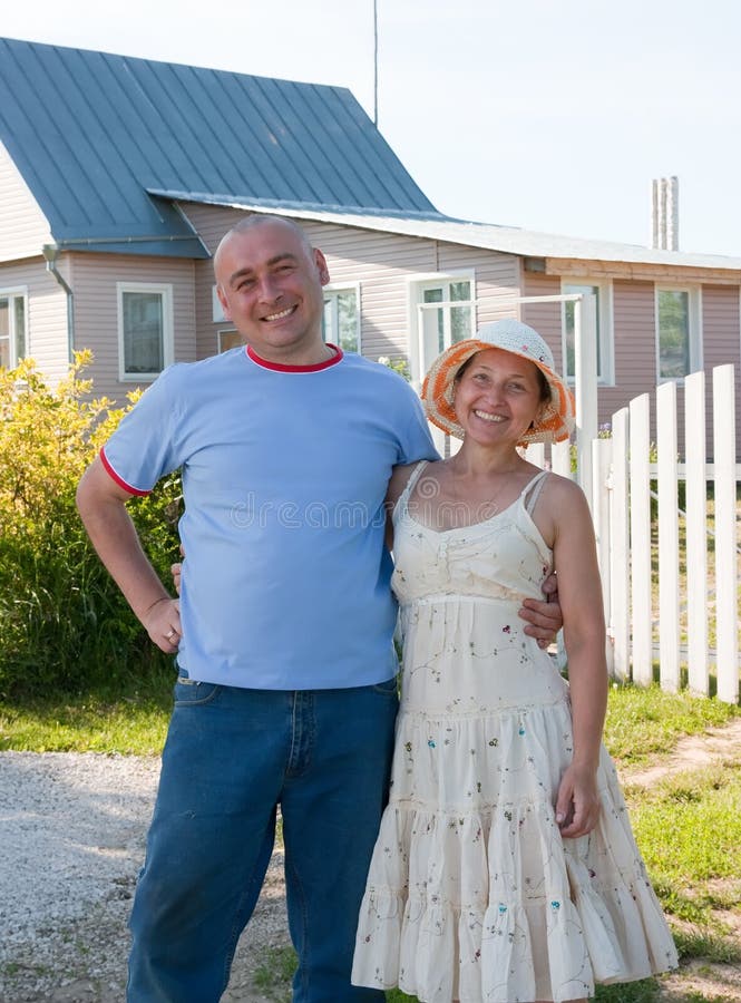 Hospitable man and woman stock image. Image of home, people - 22364745