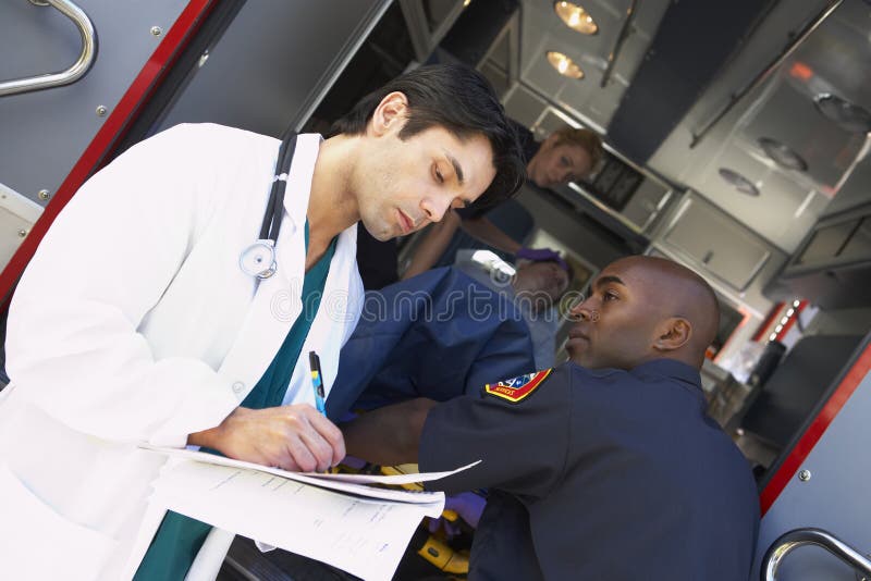 Hospital Doctor Taking Notes Paramedics Stock Photo - Image of person ...