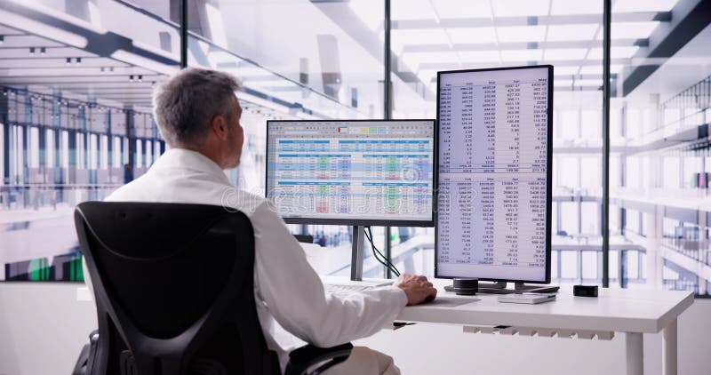 Hospital Doctor Using Spreadsheet for Billing Codes Stock Photo - Image ...