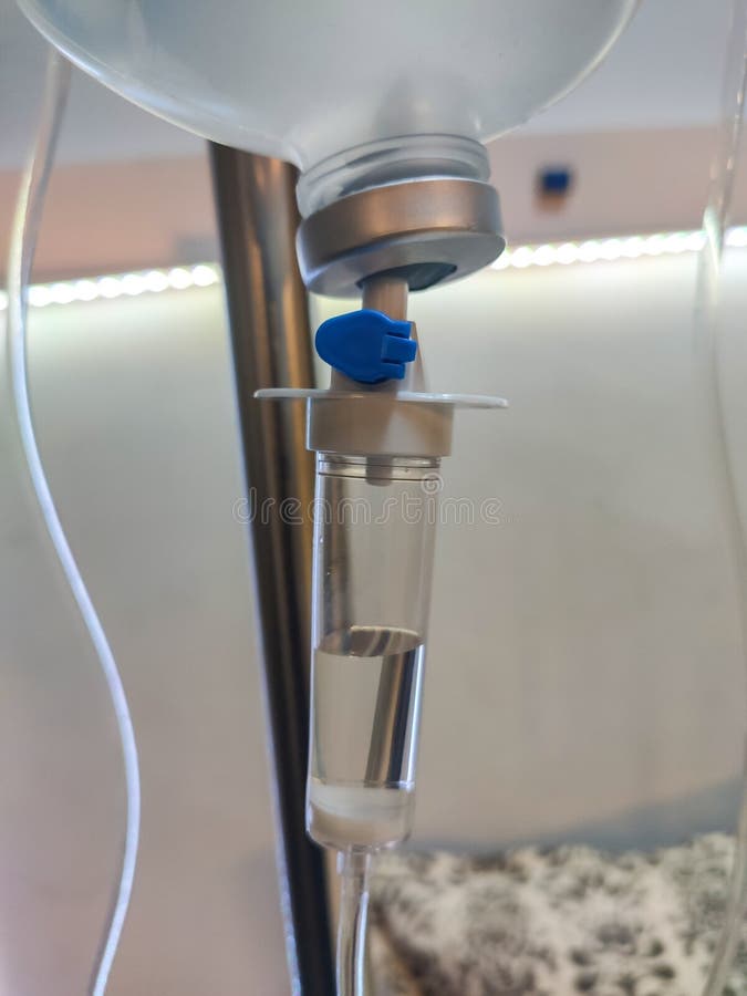 Hospital Dropper with Saline Solution. White Background with a Led ...