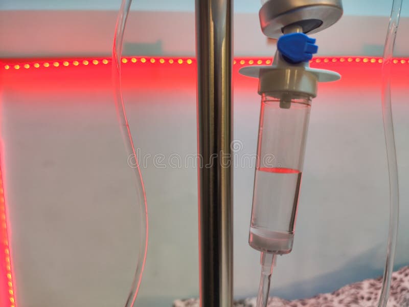 Hospital Dropper with Saline Solution. White Background with a Led ...