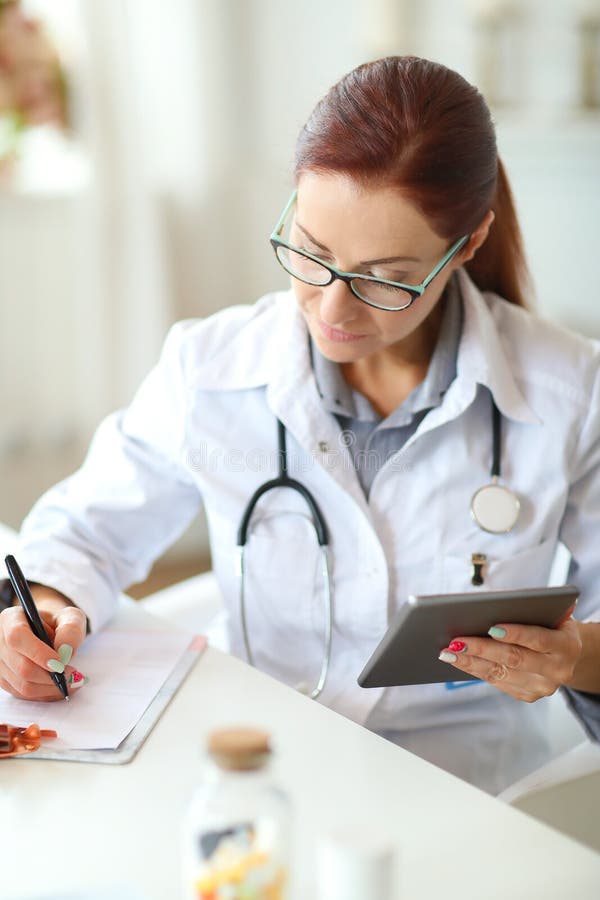 Doctor at work stock photo. Image of eyeglasses, practitioner - 115748862