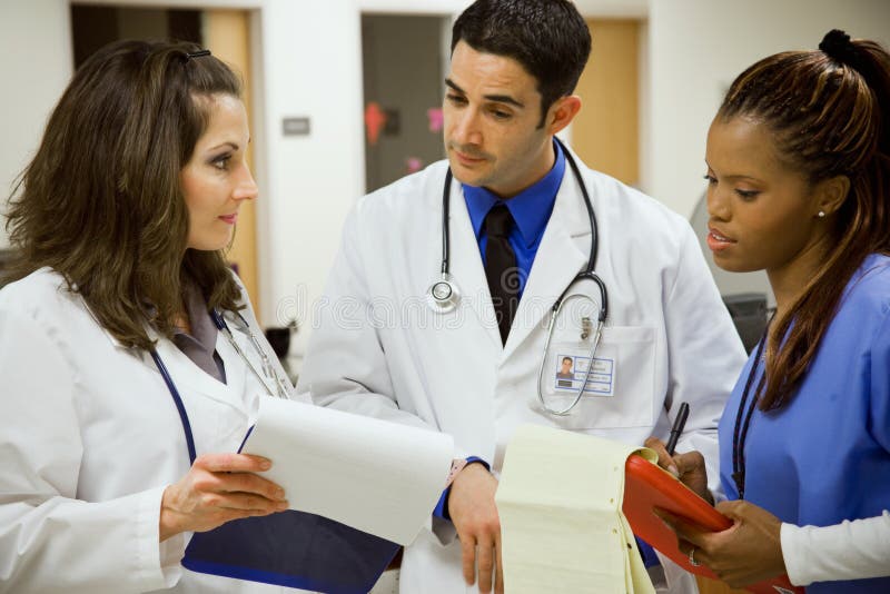 Hospital: Multi-Ethnic Medical Team at Work Stock Image - Image of ...