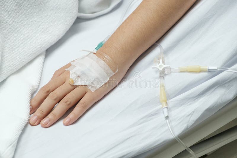Patient Hand with Saline Solution in Intravenous Drip Dropper Stock ... Patient Hand with Saline Solution in Intravenous Drip Dropper Stock ...