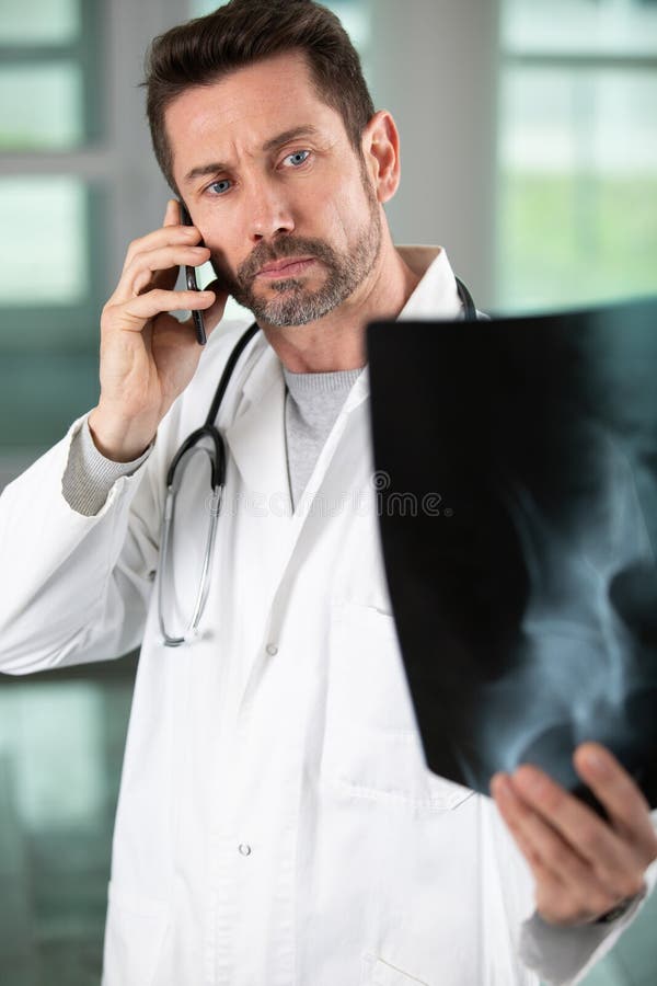 Hospital Professional Doctor with Stethoscope and X-ray on Phone Stock ...