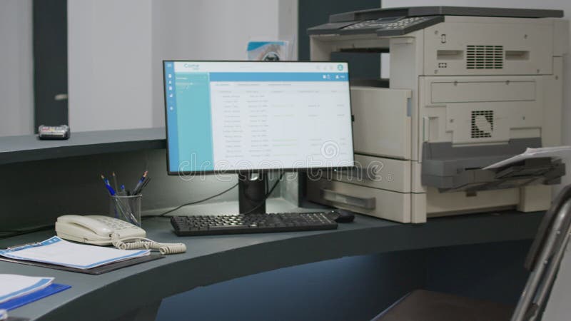 Hospital Registration Desk with Appointment Forms on Computer Stock ...