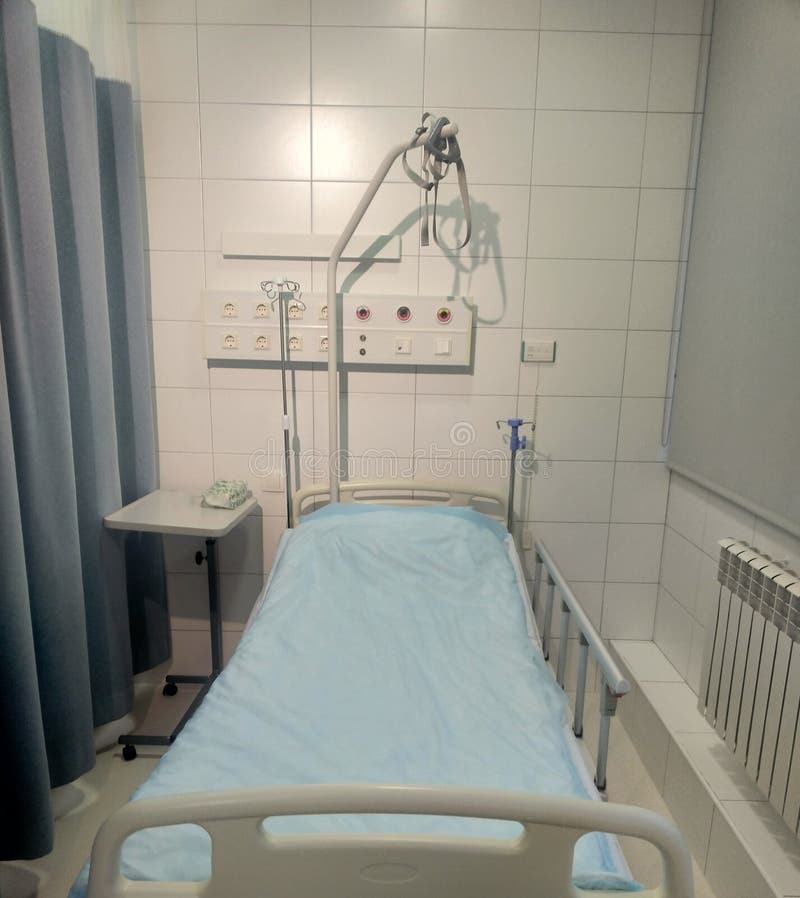 Cozy Hospital Room Showcasing a Blue Blanket on the Bed with Essential ...