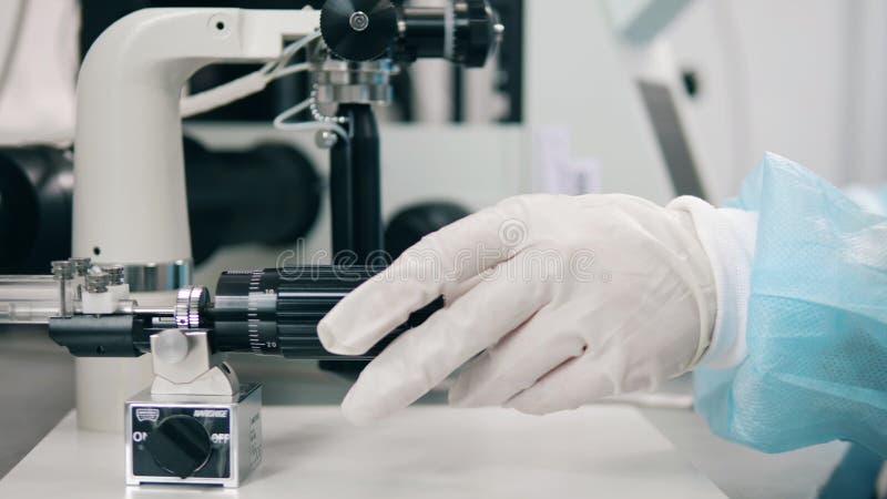 Hospital Worker Uses Microscope in a Room. Stock Video - Video of ...