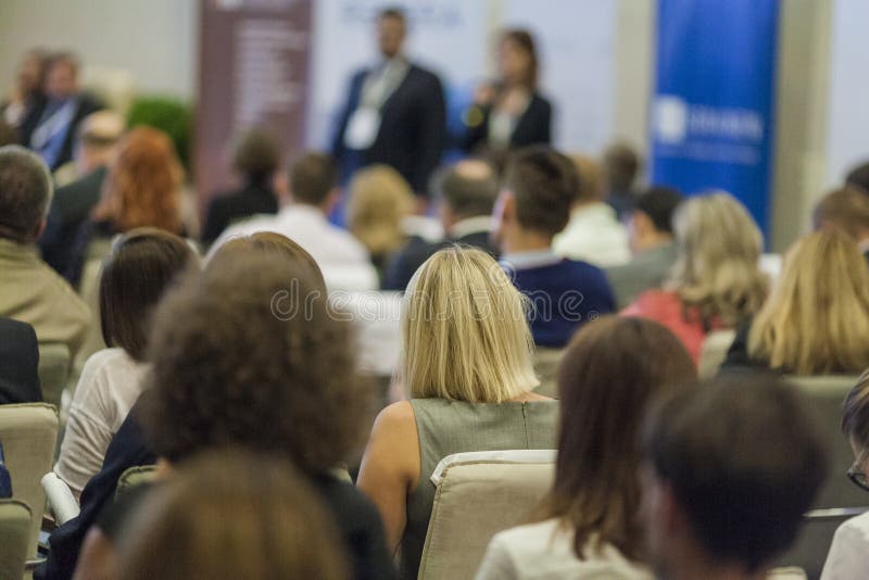 Host Speakers Standing in Front of the Audience during the Conference ...
