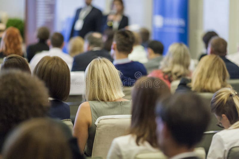 Host Speakers Talking in Front of the Audience during the Conference ...