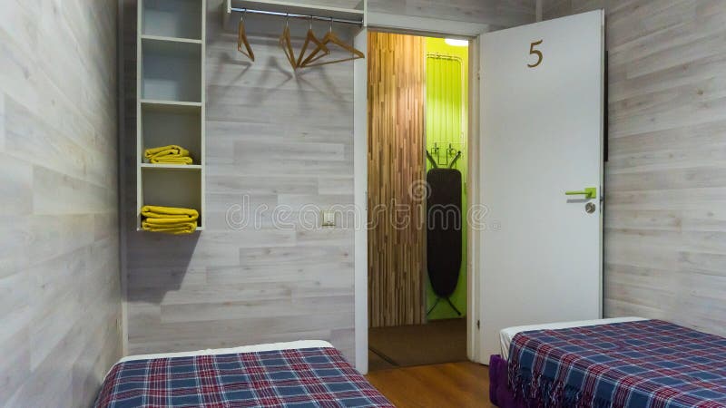 Hostel Room with Two Beds and an Open Door, Inside View of the Corridor ...