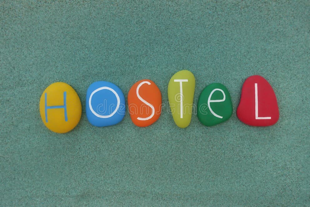 Hostel Text Composed with Colored Stones Over Green Sand Stock Photo ...