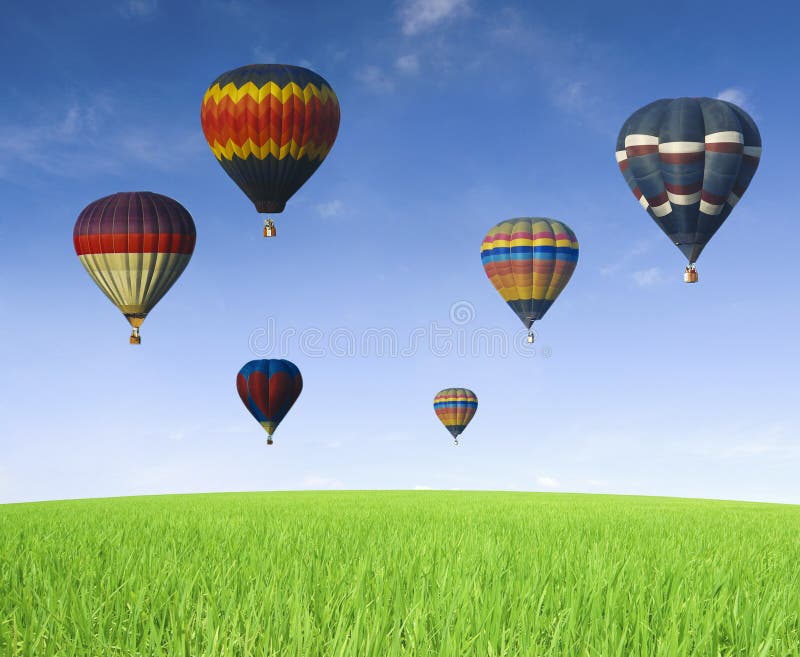 Hot Air Balloon Floating in the Sky Over Land Stock Photo - Image of ...