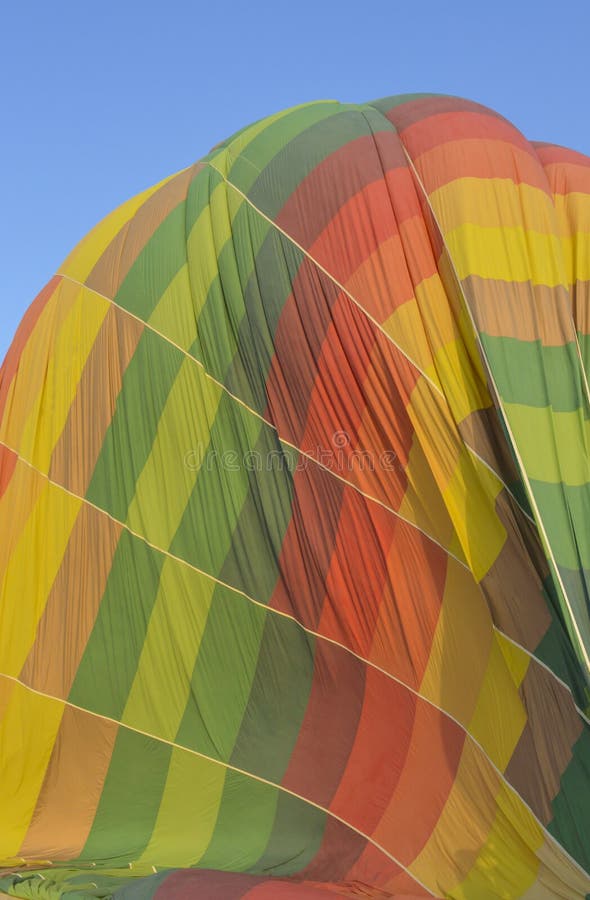 Hot Air Balloon Being Deflated on the Ground Stock Image - Image of ...