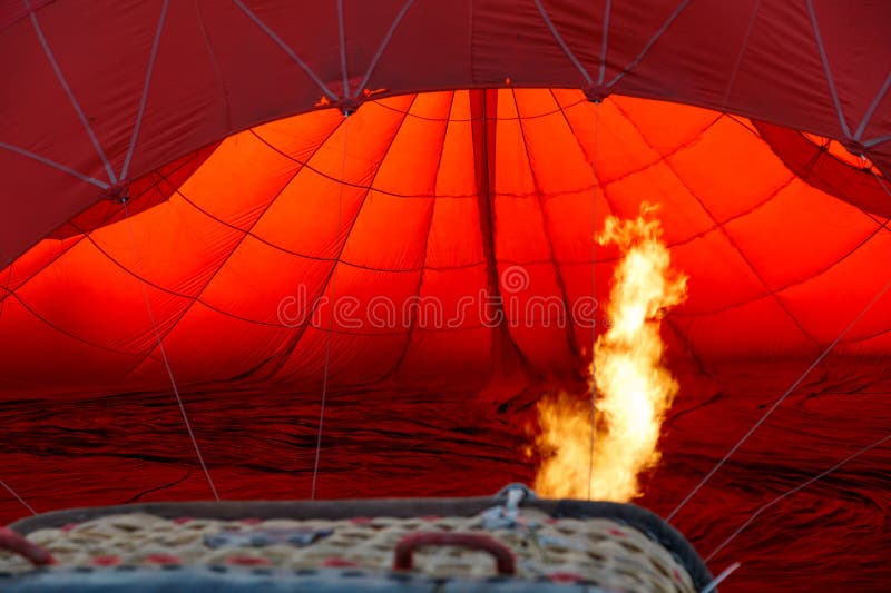 A Hot Air Balloon with a Fire in the Bottom of it Stock Image - Image ...