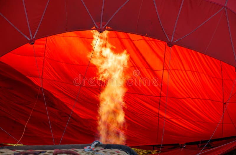 A Hot Air Balloon with a Fire in the Bottom of it Stock Image - Image ...