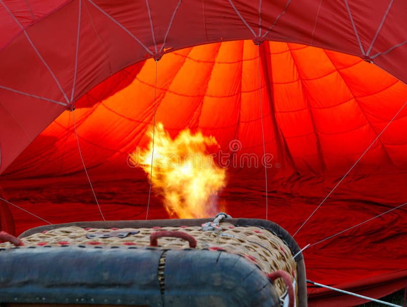 A Hot Air Balloon with a Fire in the Bottom of it Stock Photo - Image ...