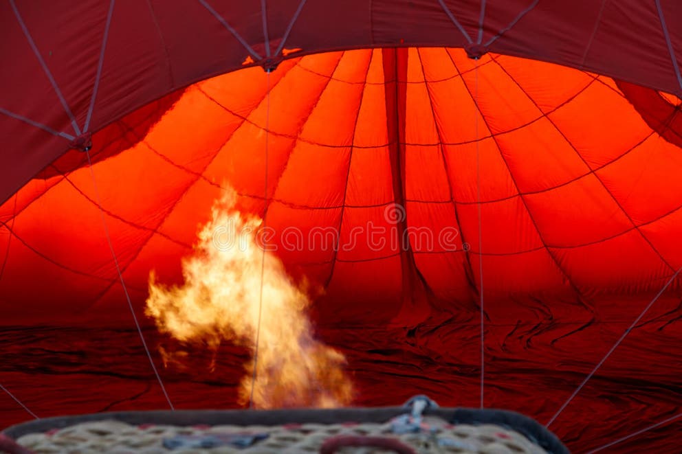 A Hot Air Balloon with a Fire in the Bottom of it Stock Image - Image ...